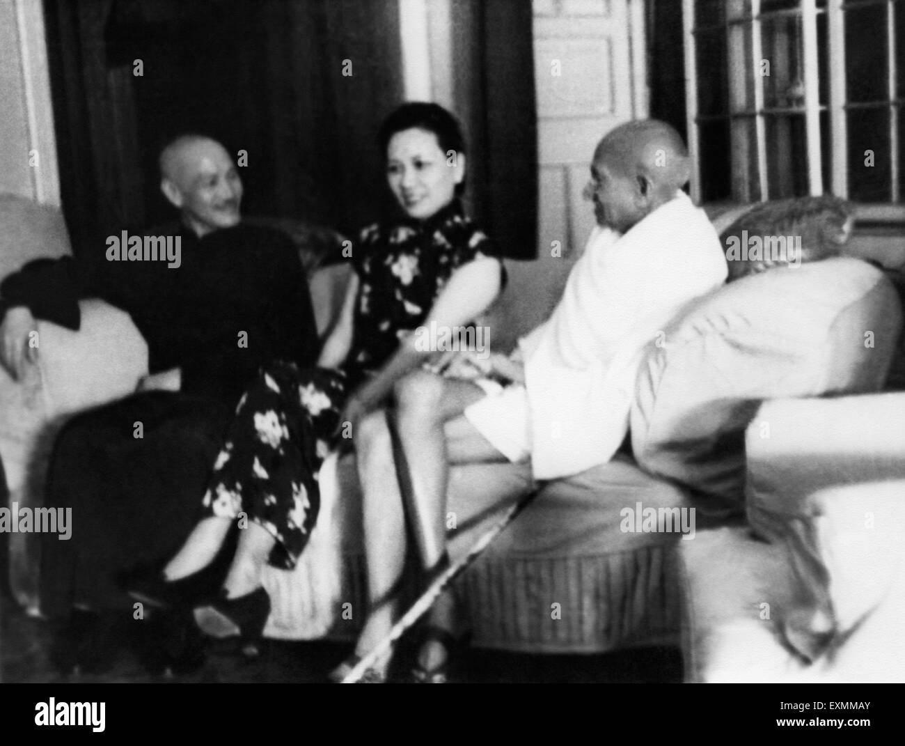 Mahatma Gandhi talking with Chinese leader Chiang Kai Chek and his wife ...
