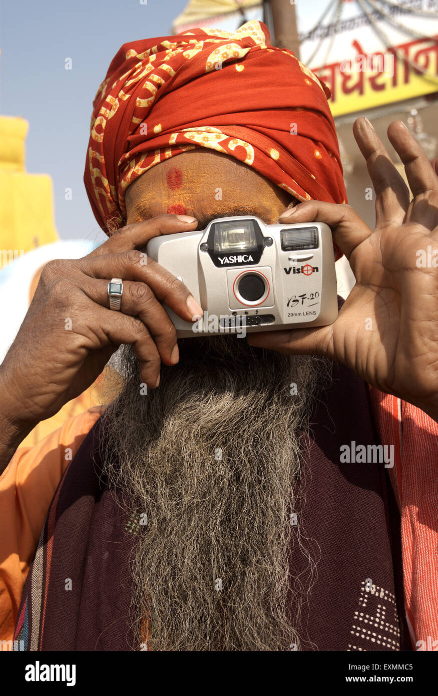 sadhu takes photographs fellow sadhus film camera Ardh Kumbh Mela ...