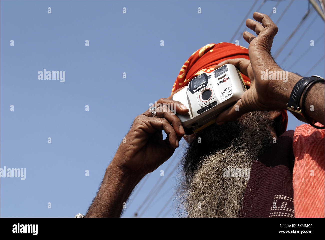 sadhu takes photographs sadhus film camera Ardh Kumbh Mela religious ...