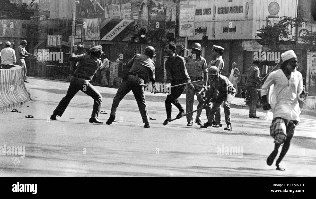 police hitting man with sticks controlling riots mumbai maharashtra ...