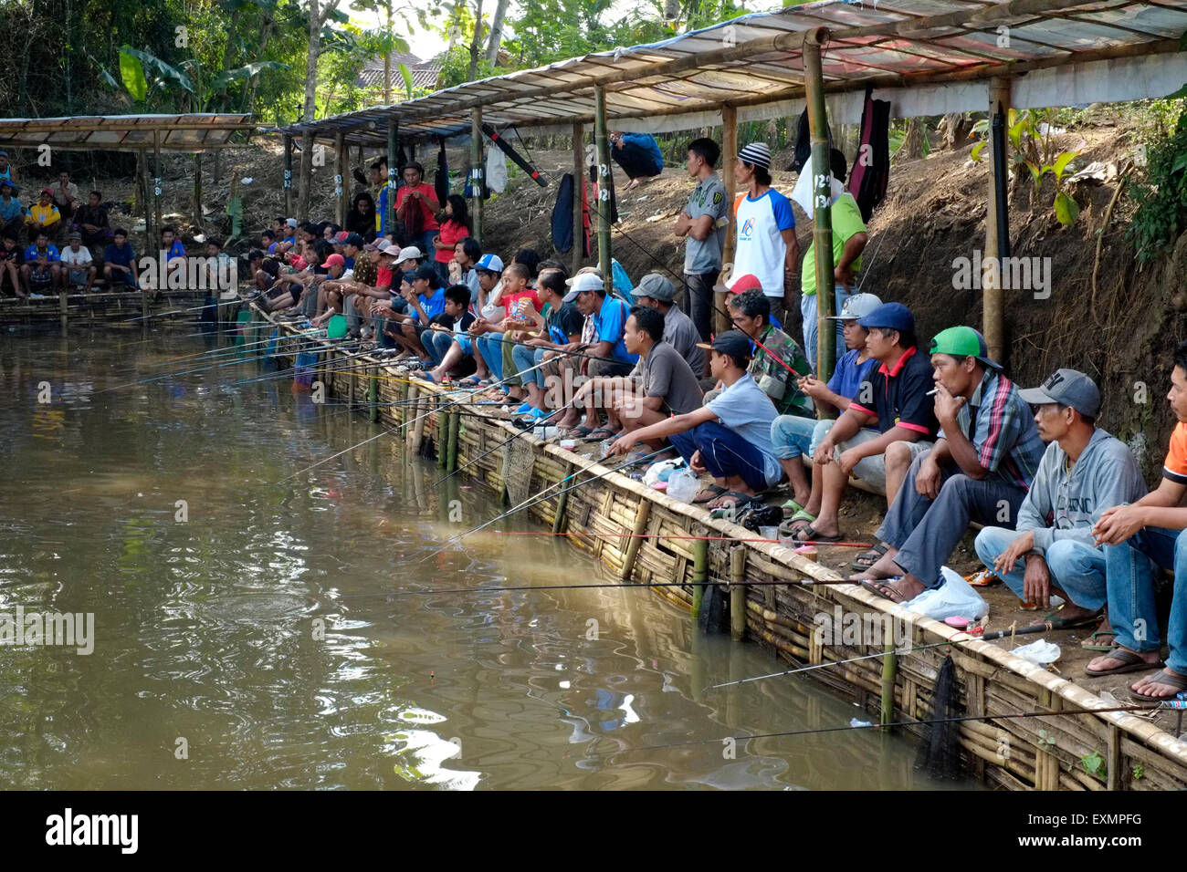 fishing indonesian style at a popular rural village man made pool near ...