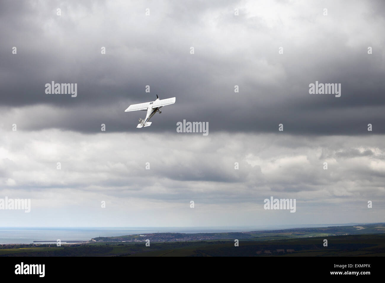 Aerial photograph of a microlight, a lightweight modern airplane, over ...