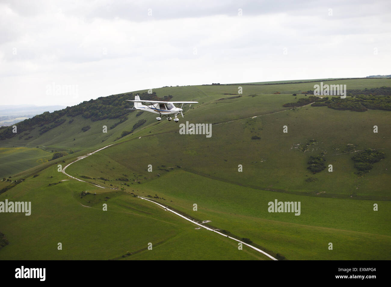 Aerial photograph of a microlight, a lightweight modern airplane, over ...