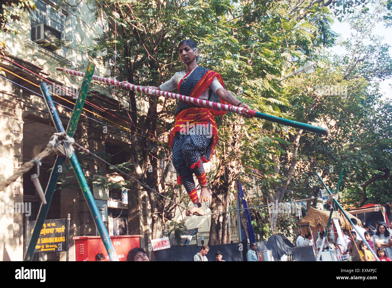 Tightrope walking, funambulism, woman walking skill on thin rope, Kala ...