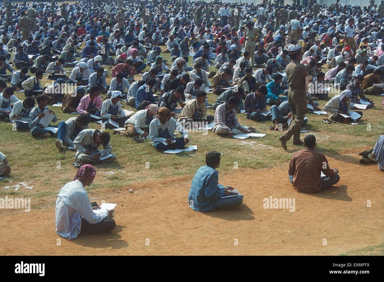 People writing written exam, police employment recruitment, Bombay ...