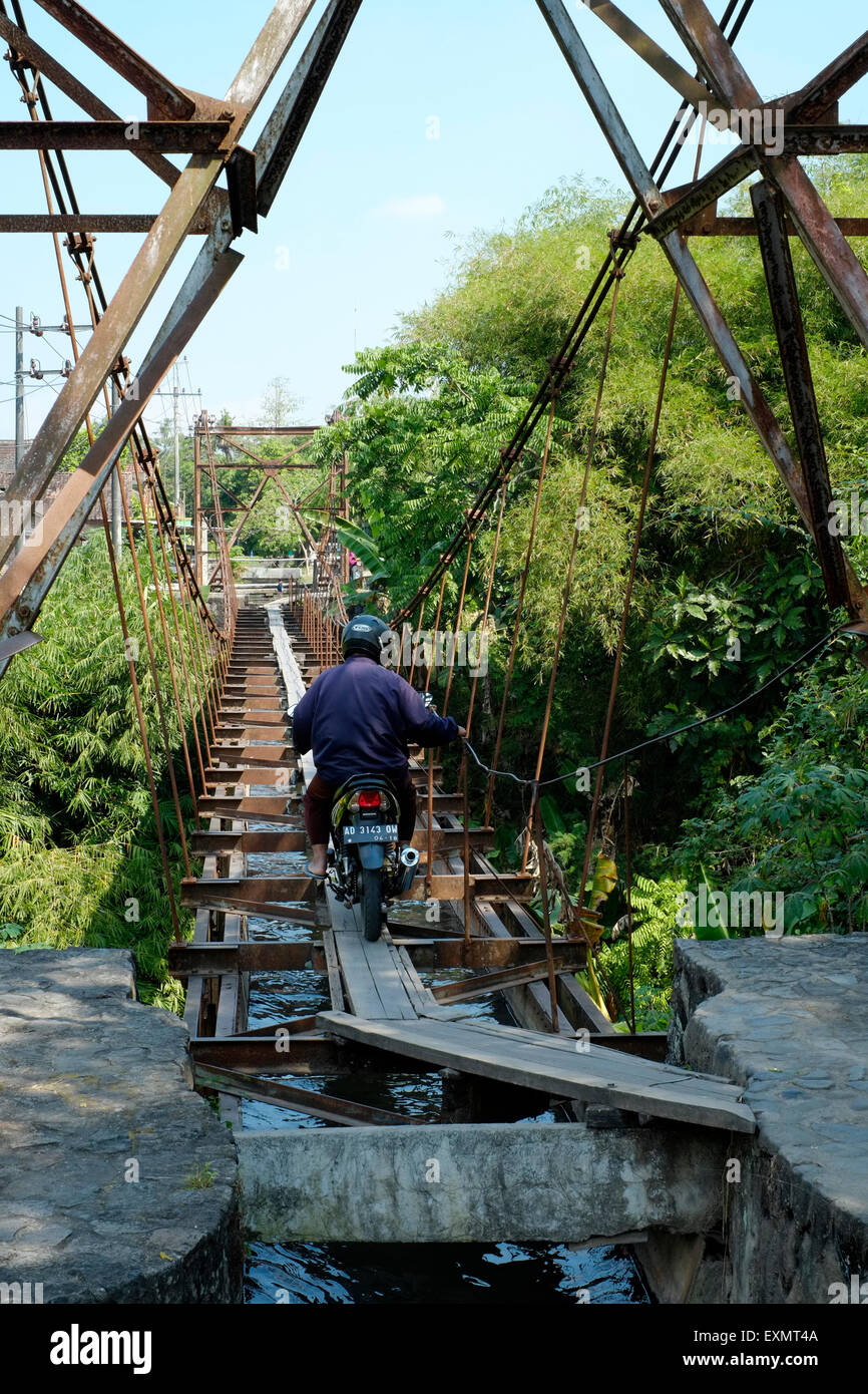 dangerous unstable bridge over ravine not designed for people is used ...