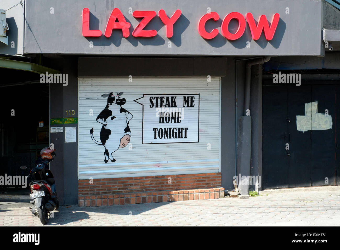 the unusually named lazy cow restaurant in solo java indonesia Stock ...