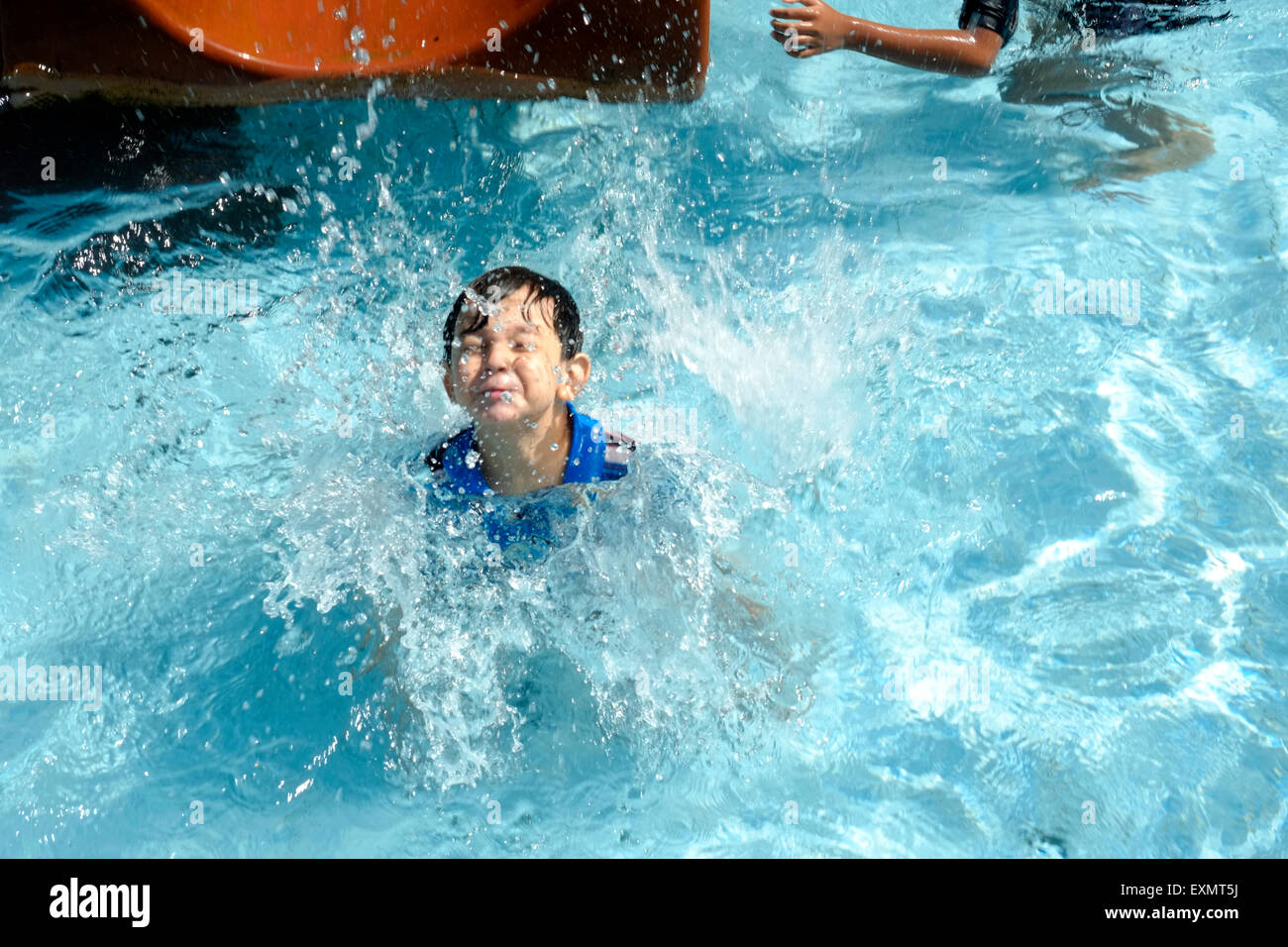 Indonesian children playing in the water hi-res stock photography and ...