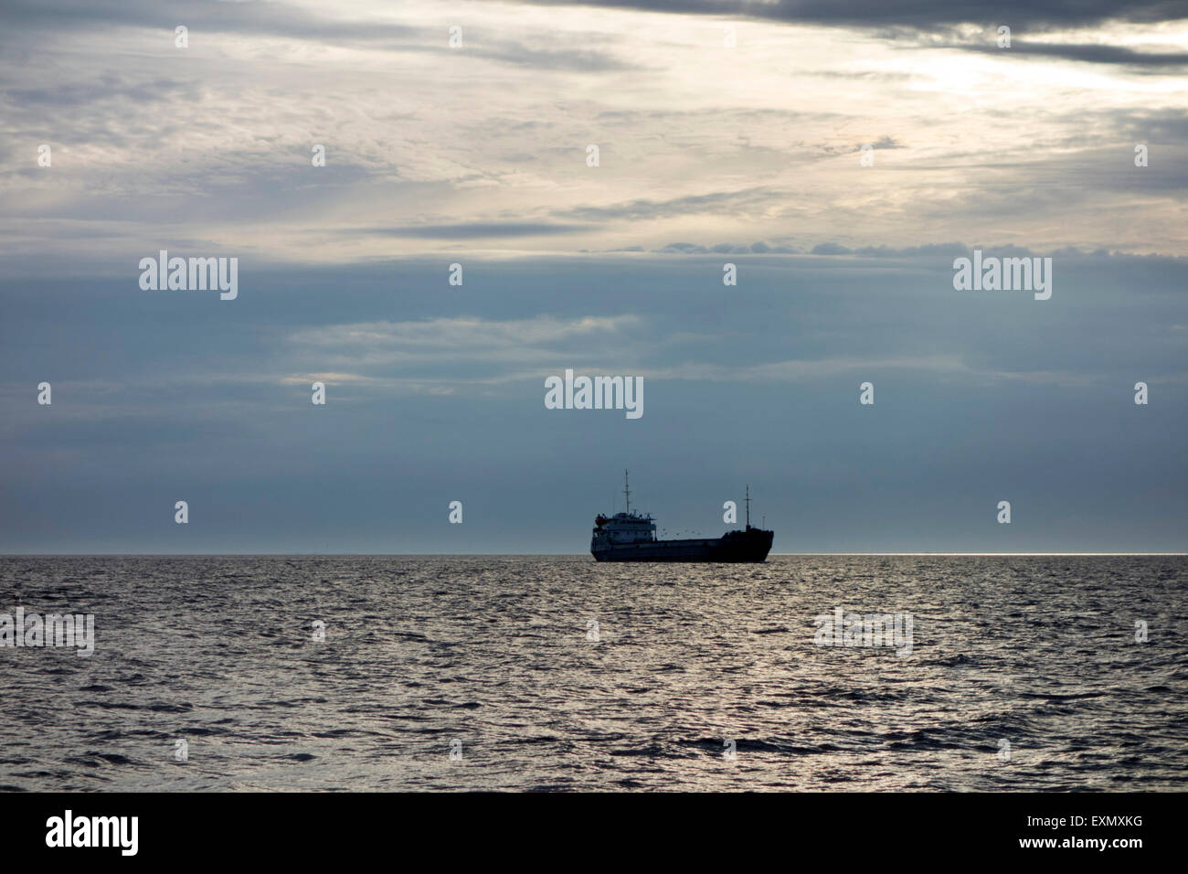 Container ship in sunset Stock Photo - Alamy