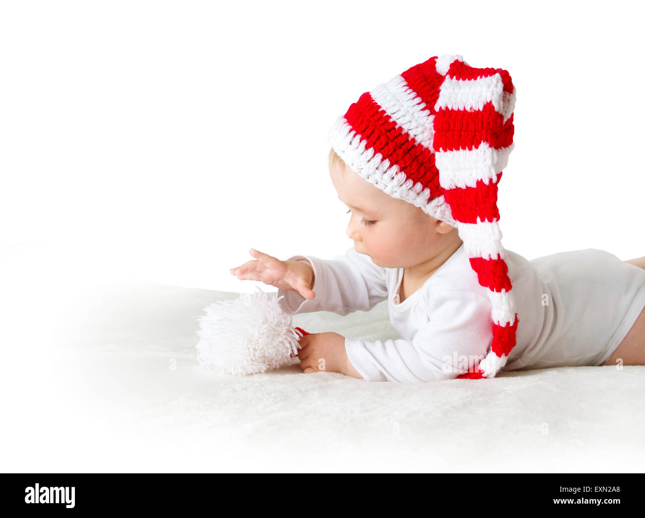 Baby in red white knitted hat Stock Photo - Alamy