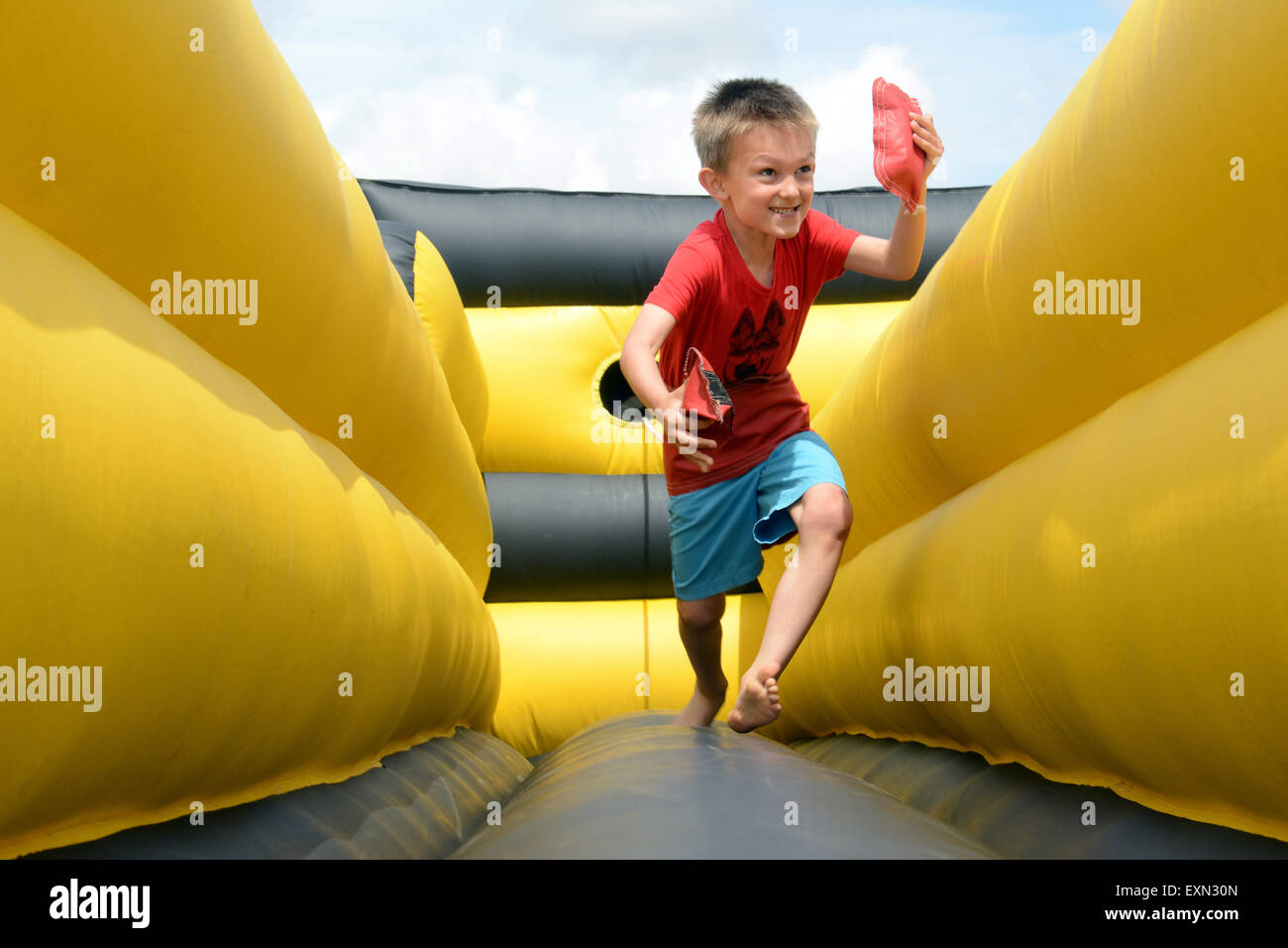 Young boy child running on inflatable bungee run Adult's & Children's ...