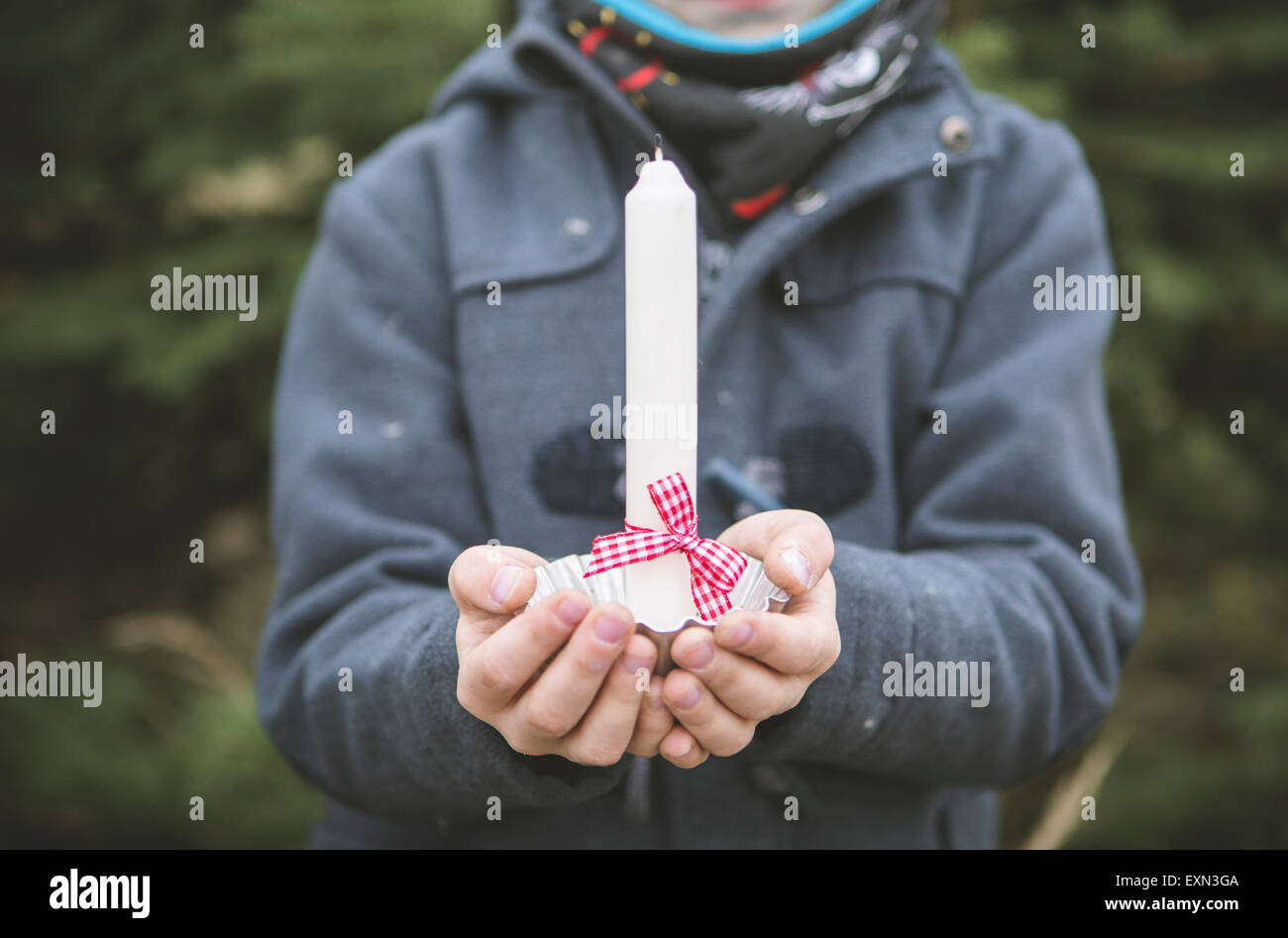 Boy holding festive candle Stock Photo - Alamy