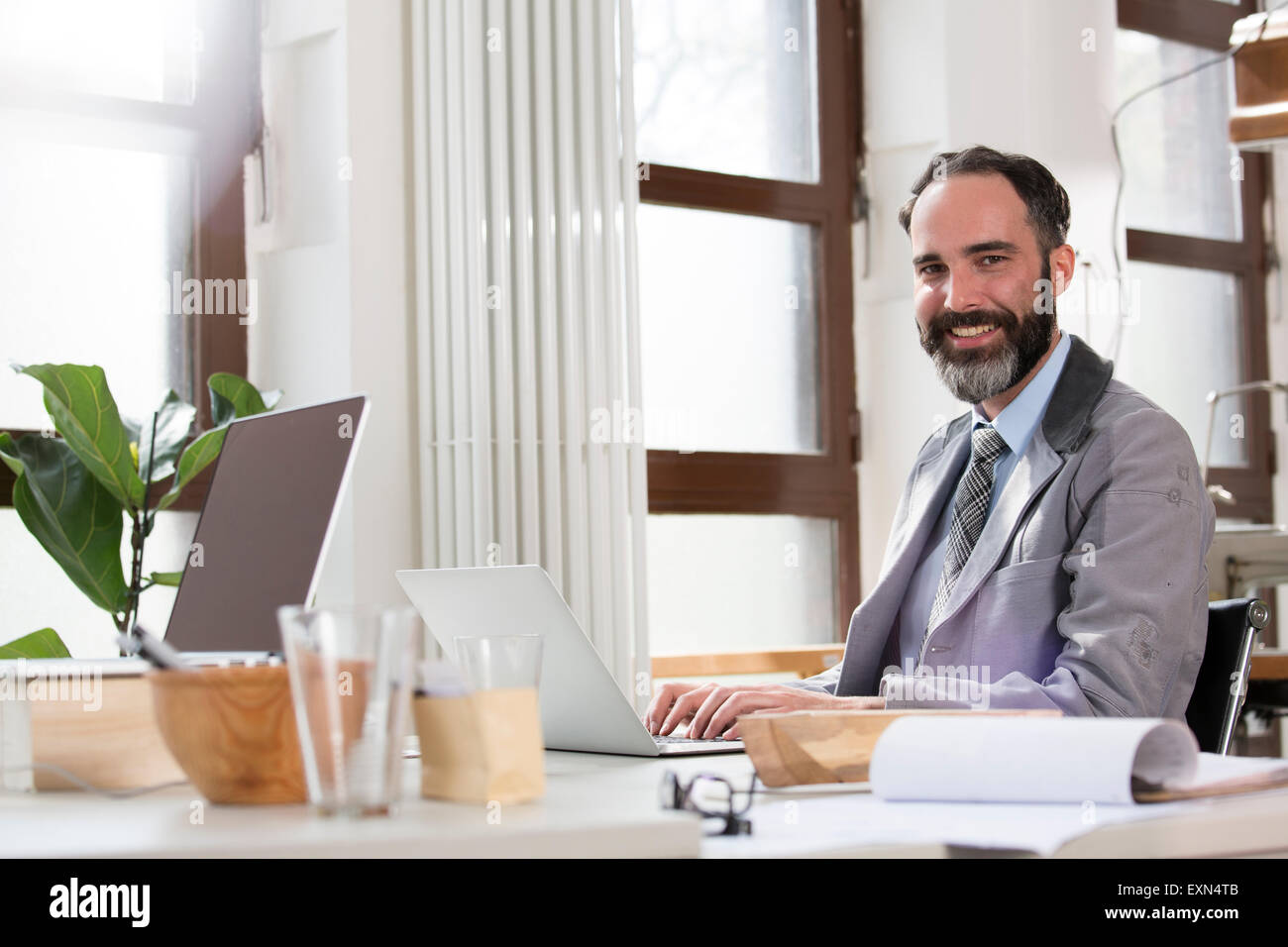 Fashion designer working in office Stock Photo - Alamy