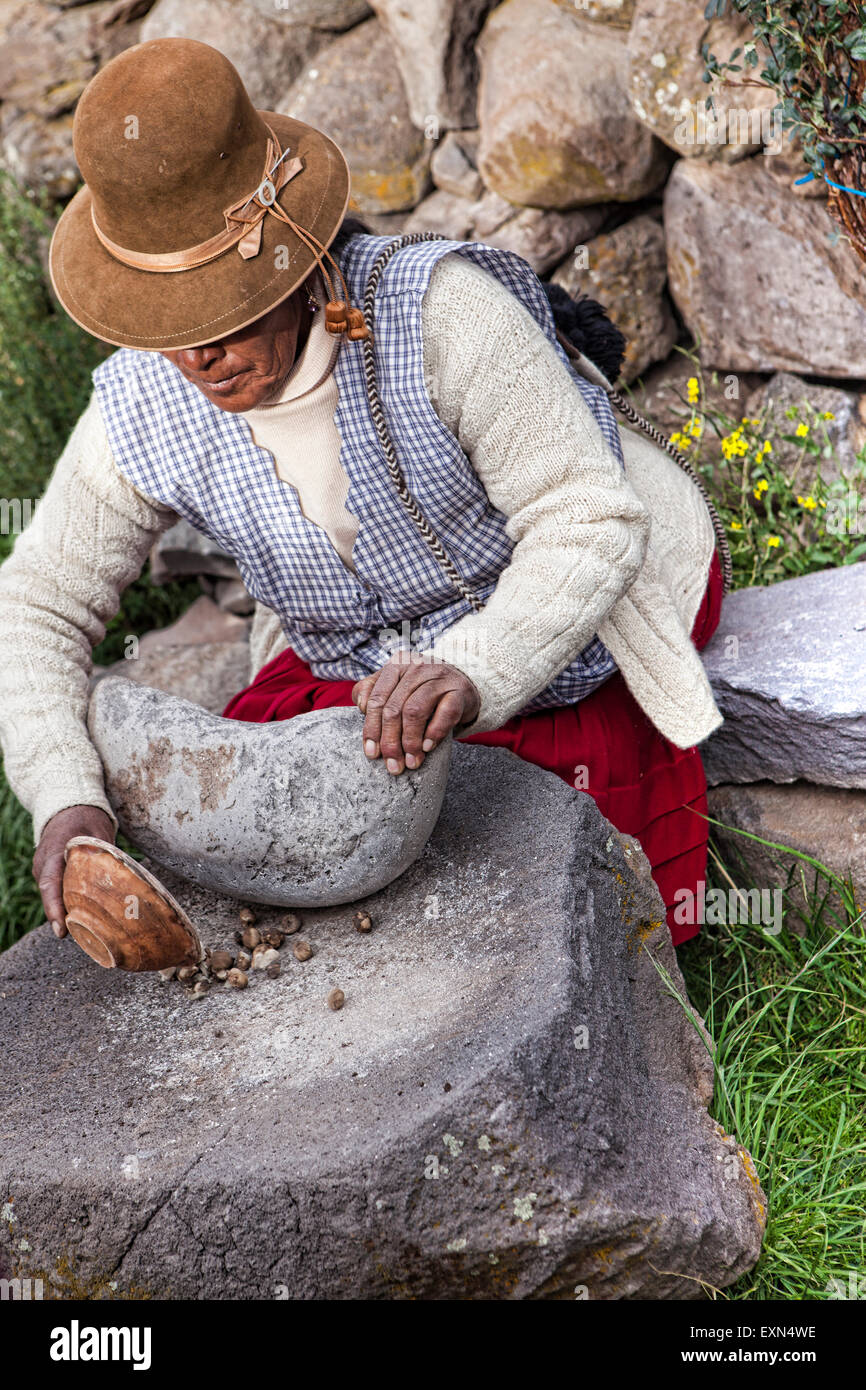 Woman grinding flour hi-res stock photography and images - Alamy