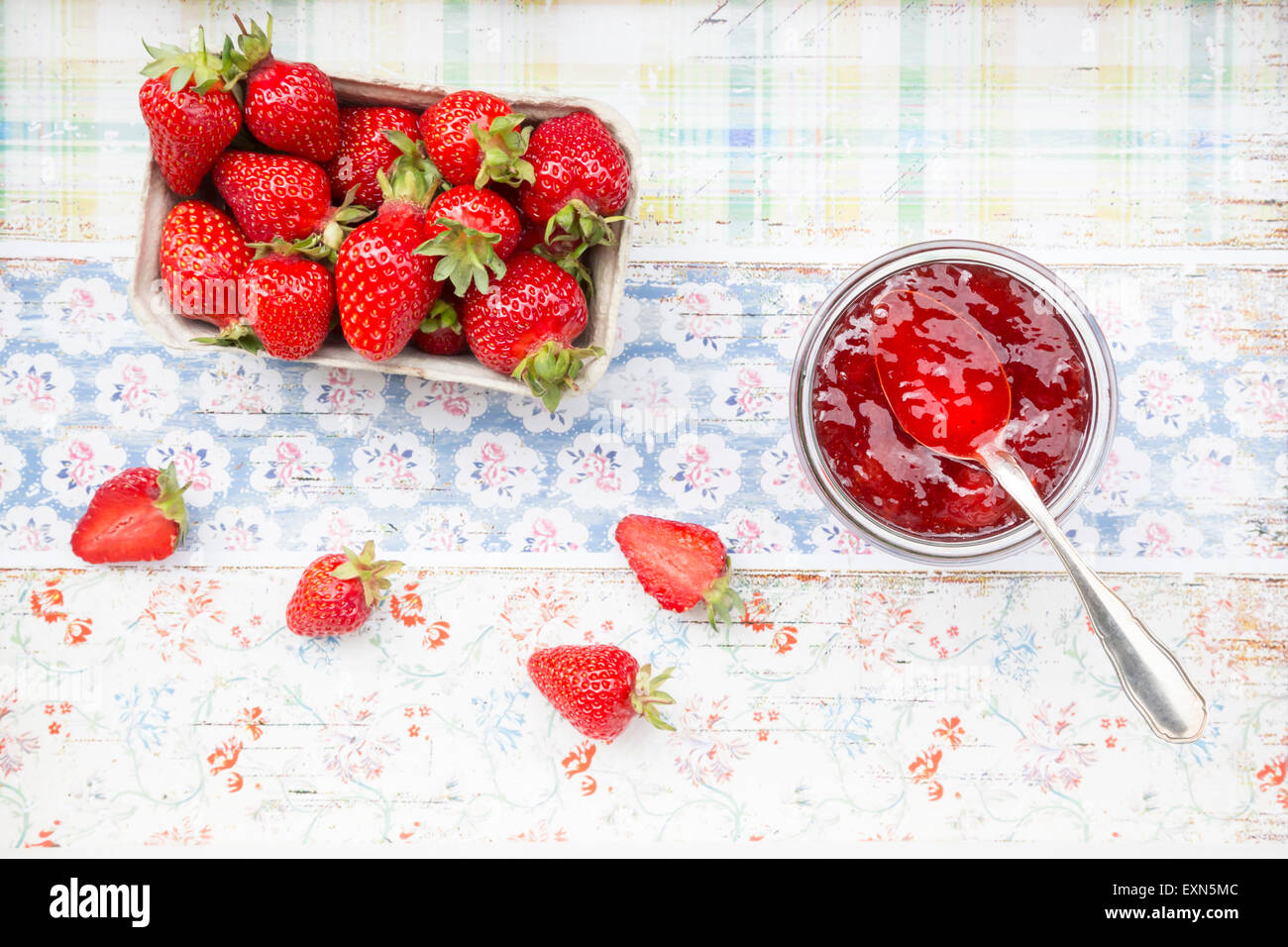 Glass of strawberry jam and box of strawberries Stock Photo - Alamy