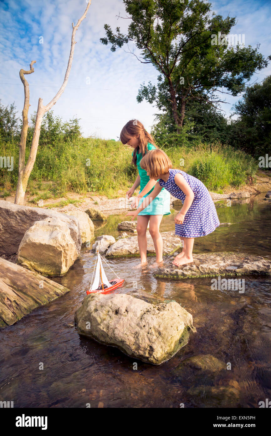 Child with toy boat hi-res stock photography and images - Alamy