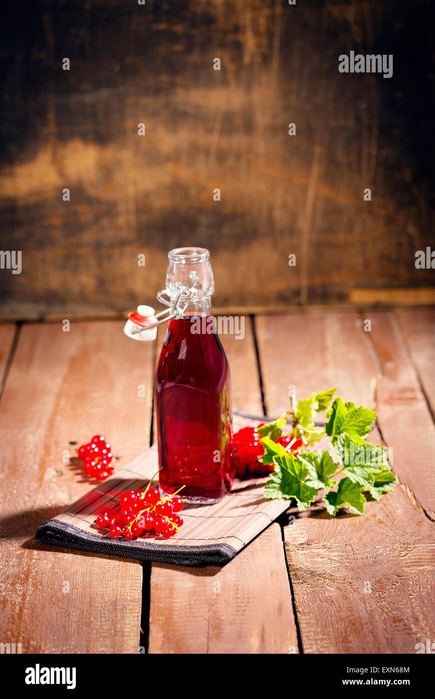 Swing top bottle with red currant juice Stock Photo - Alamy
