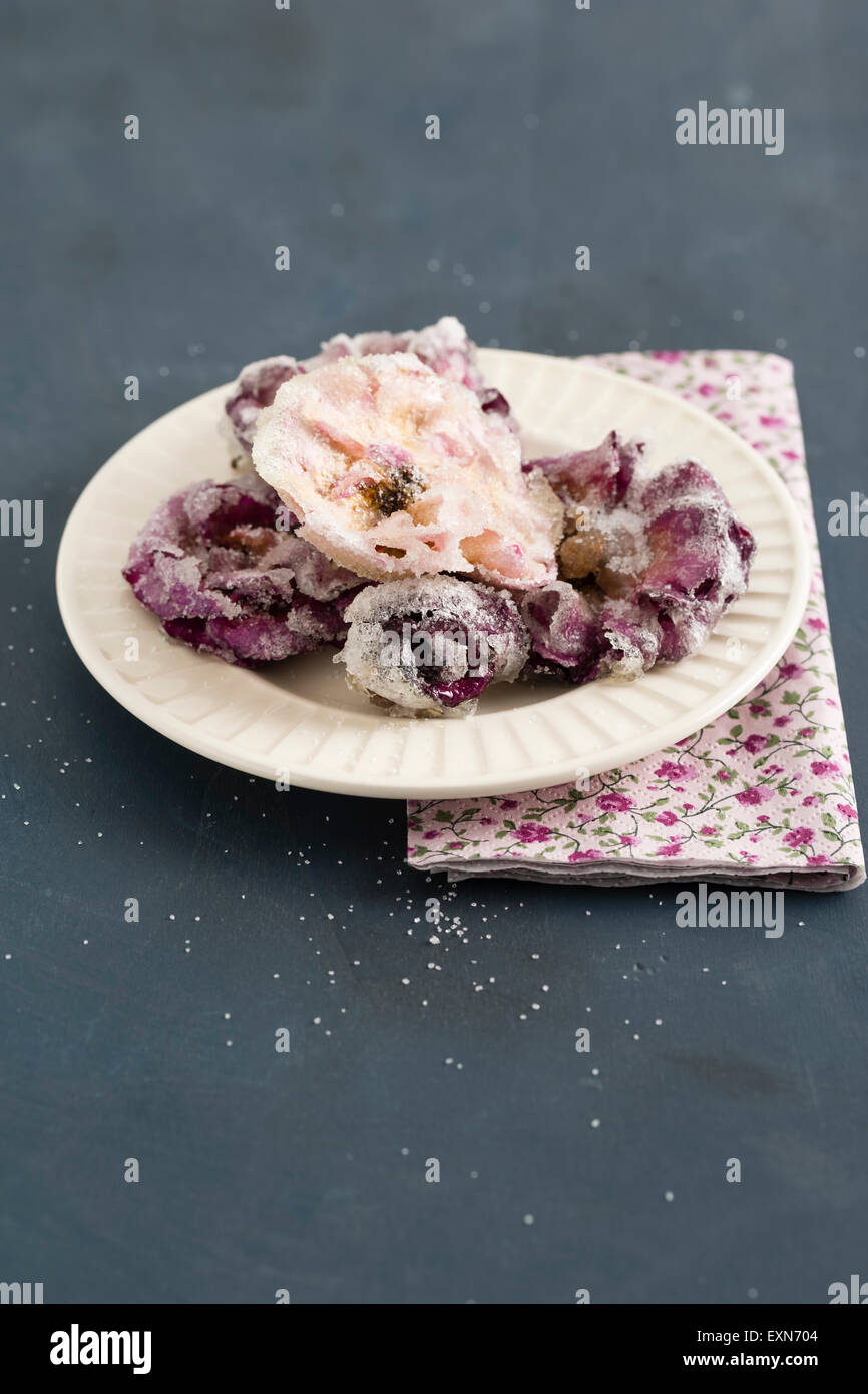 Sugared rose petals on plate Stock Photo - Alamy