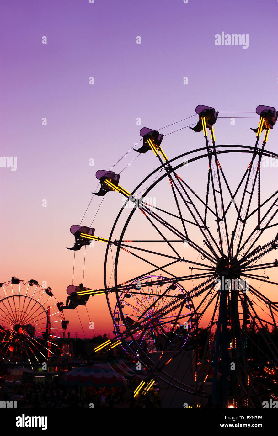 Silhouettes of carnival rides under sunset Stock Photo - Alamy