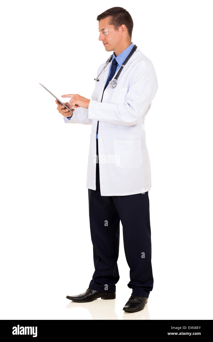 side view of young medical doctor using tablet computer isolated on ...