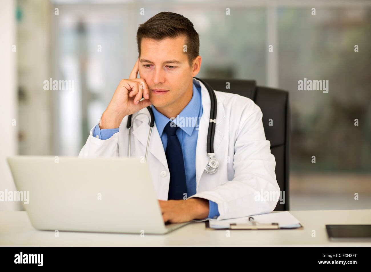 professional young medical doctor using laptop in office Stock Photo ...