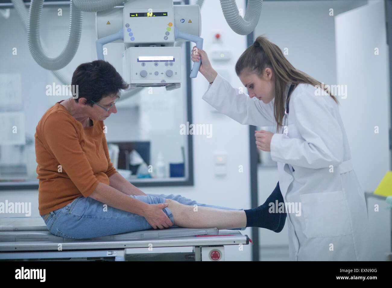 Young doctor with patient preparing an x-ray Stock Photo - Alamy