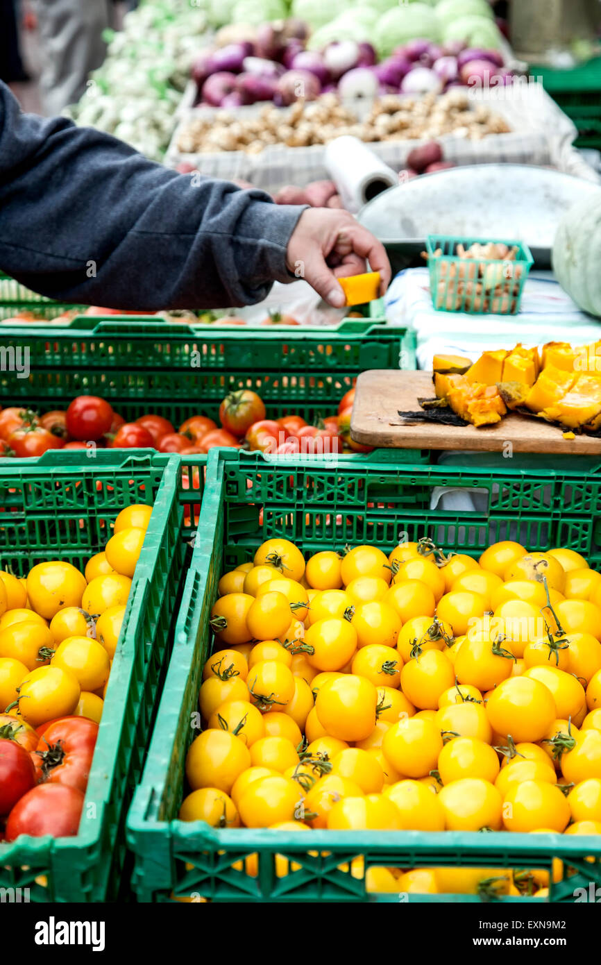 Picking a sample at produce stall, Farmers' Market, Railyard District ...