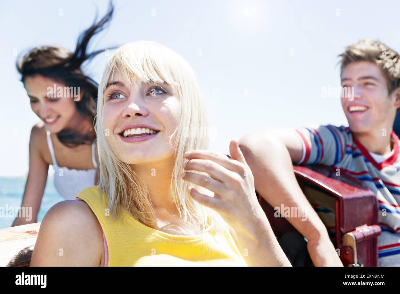 Happy friends on a sailing ship Stock Photo - Alamy