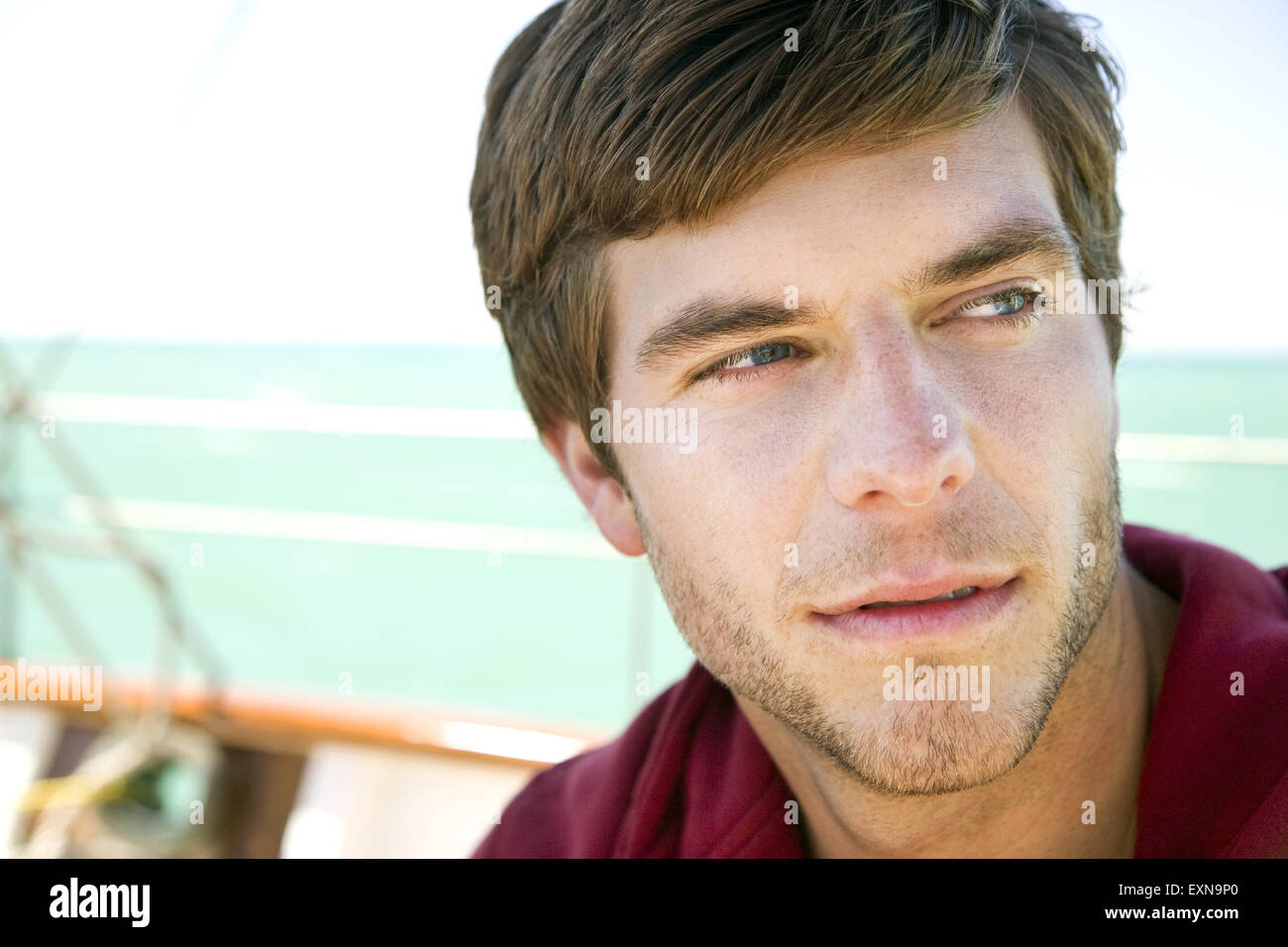 Portrait of young man on a sailing ship Stock Photo - Alamy