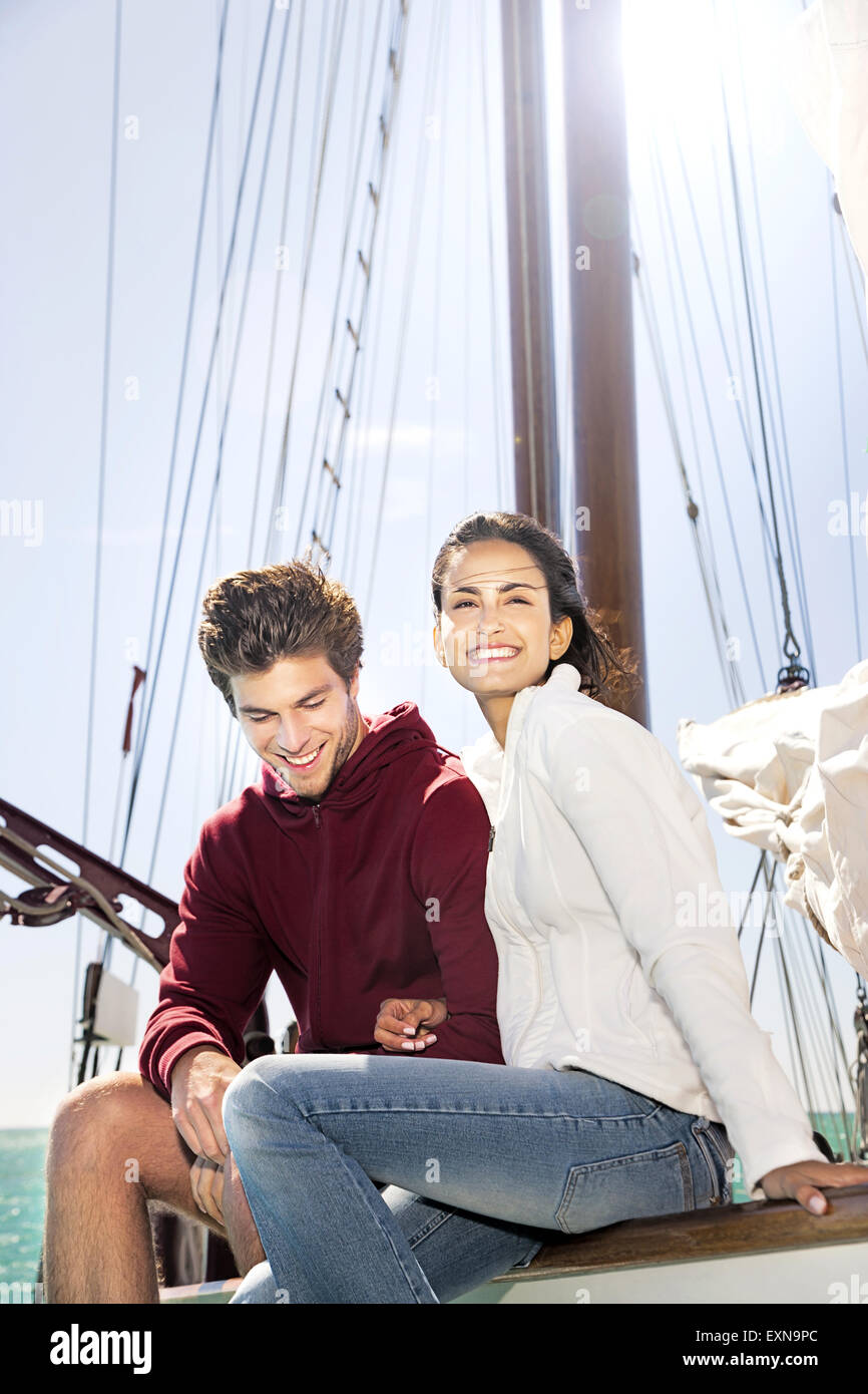Happy young couple on a sailing ship Stock Photo - Alamy