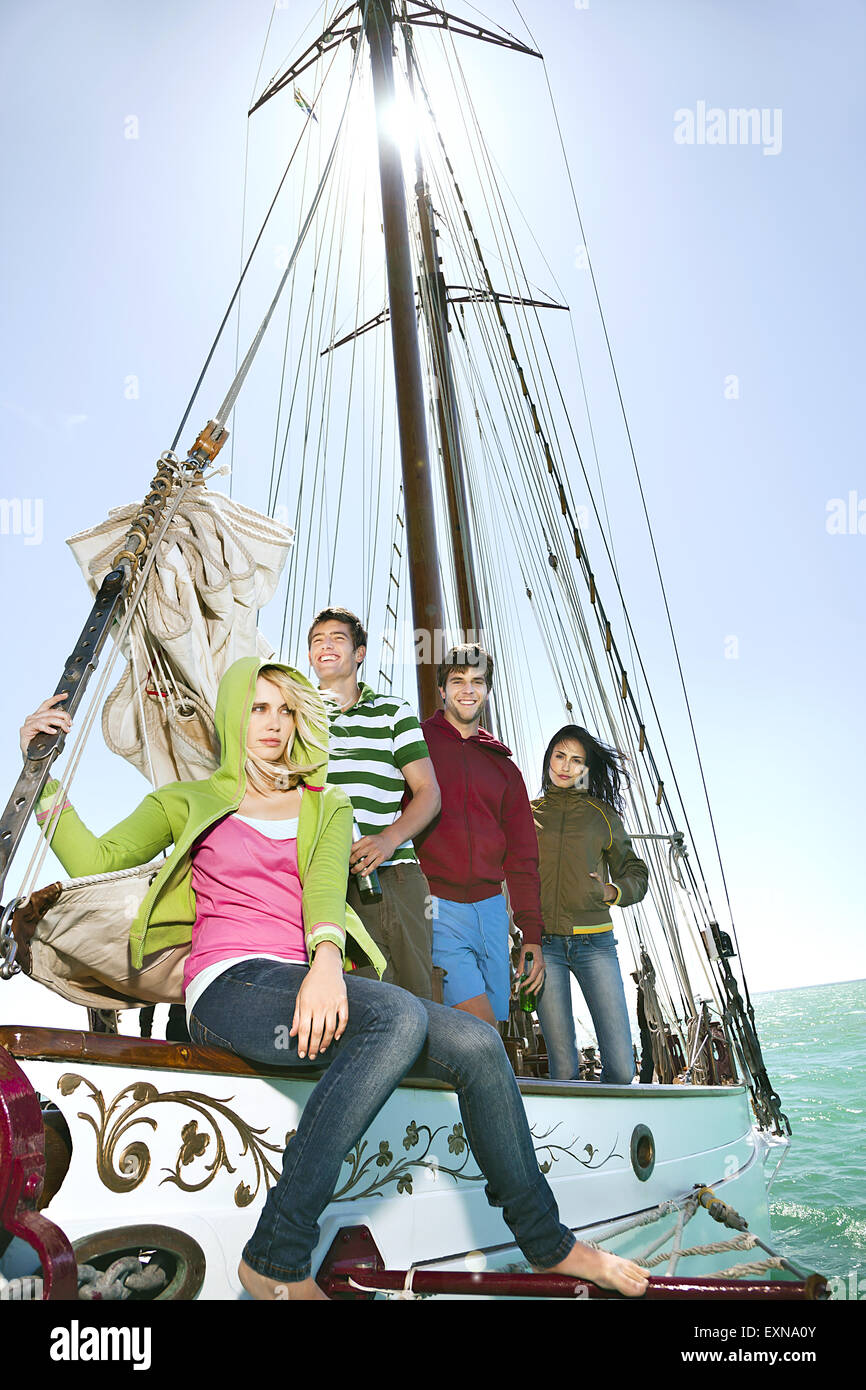 Friends on a sailing ship Stock Photo - Alamy