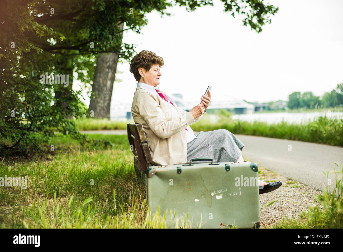 Old people sitting down sitting on bench hi-res stock photography and ...