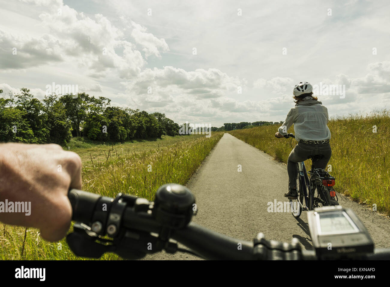 Couple riding bicycle at countryside Stock Photo - Alamy