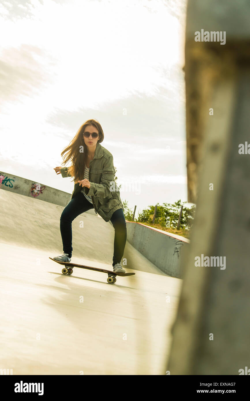 Young woman skate boarding in a skatepark Stock Photo - Alamy