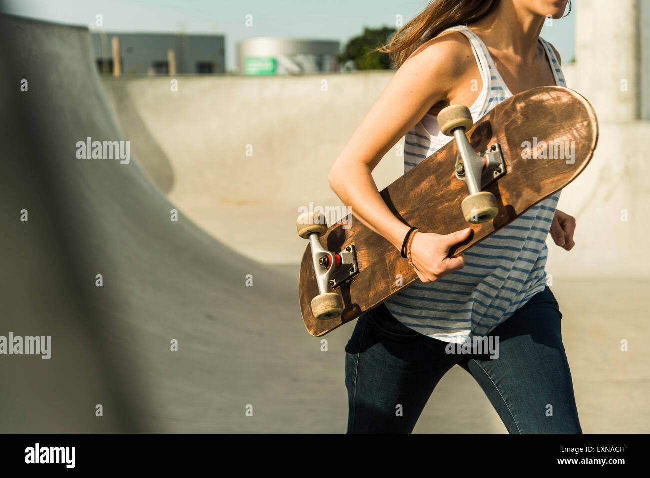 Young skate boarder running in a skatepark, close-up Stock Photo - Alamy