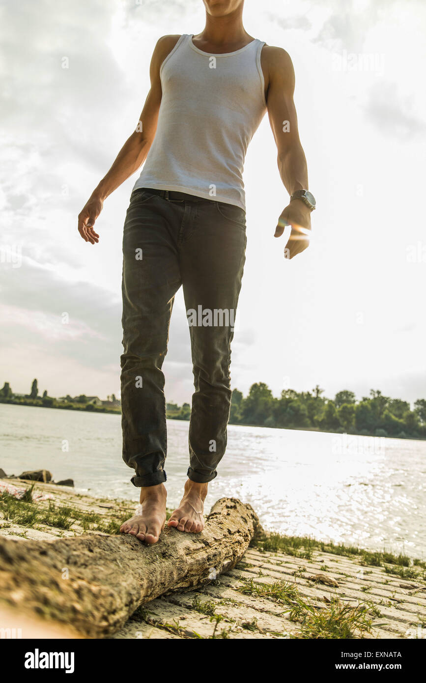 Young man balancing on a log hi-res stock photography and images - Alamy