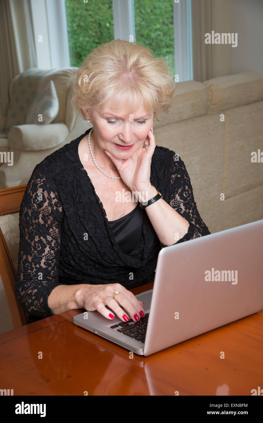 Old lady using a laptop hi-res stock photography and images - Alamy