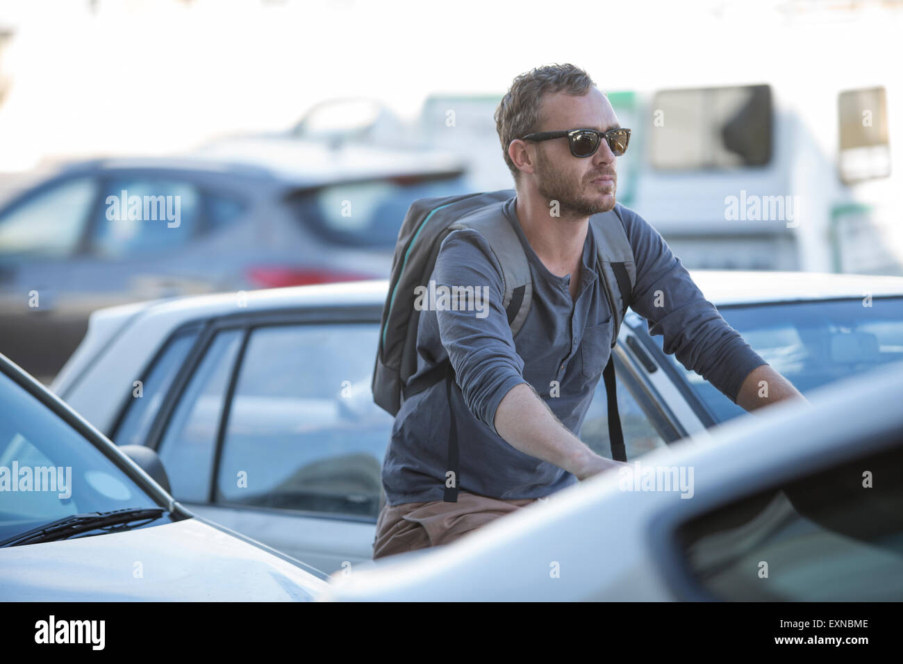 Man on bicycle in traffic jam Stock Photo - Alamy