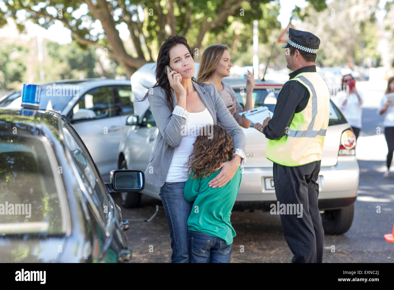 People and policeman at car accident scene Stock Photo - Alamy