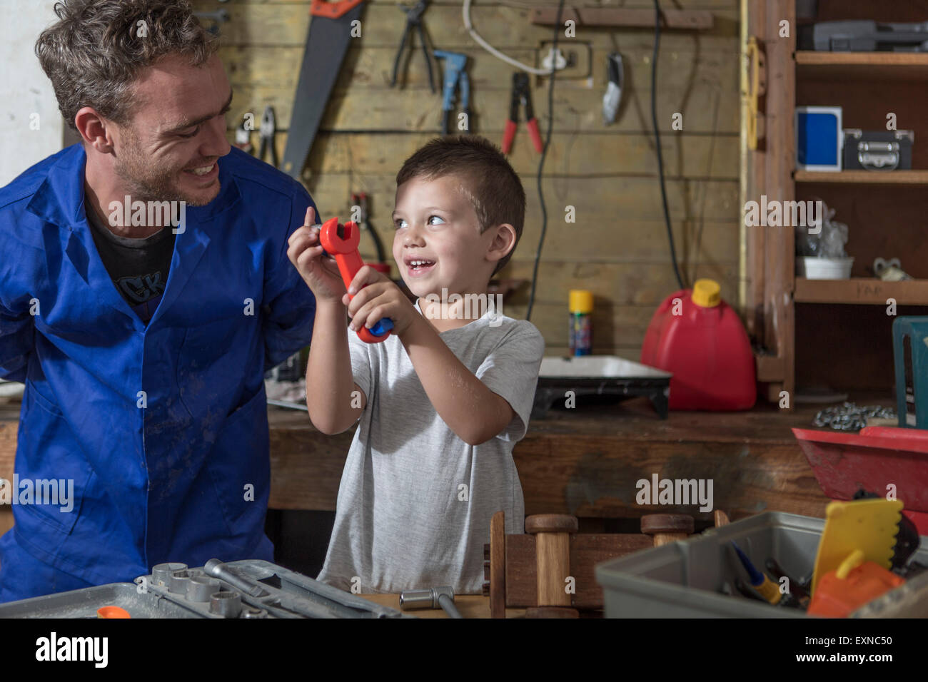 Father son working in garage hi-res stock photography and images - Alamy