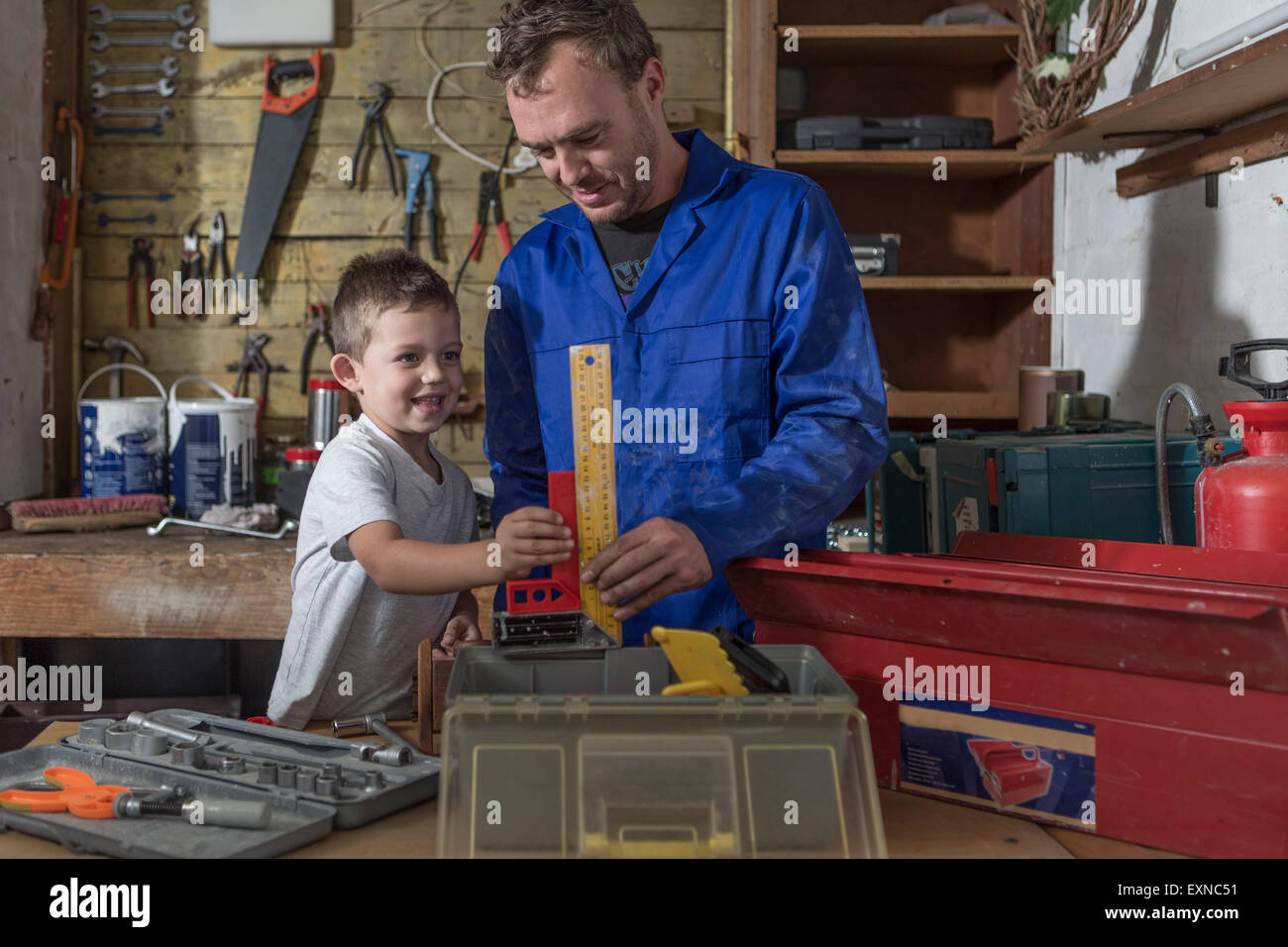 Father son working in garage hi-res stock photography and images - Alamy