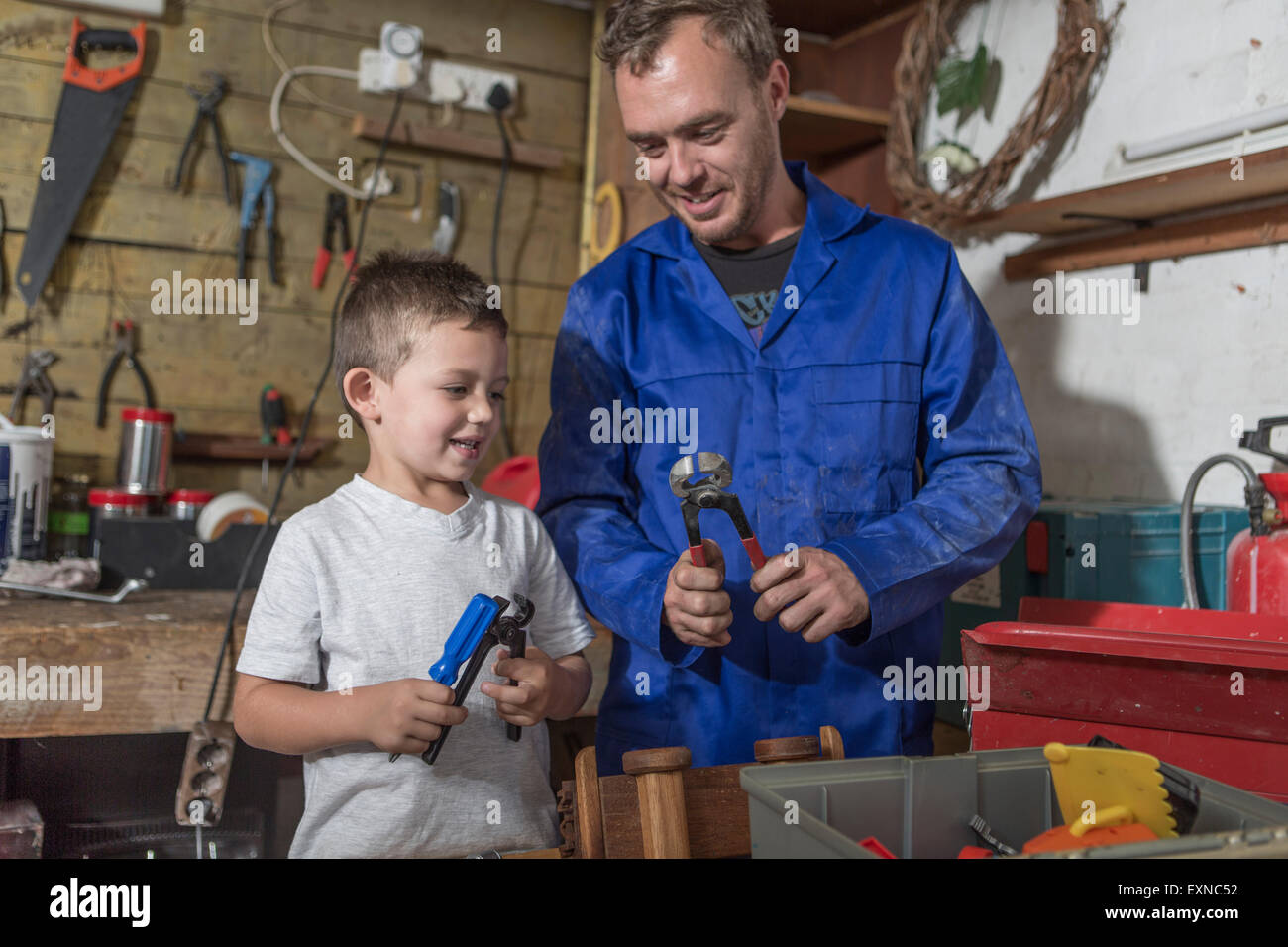 Father son working in garage hi-res stock photography and images - Alamy