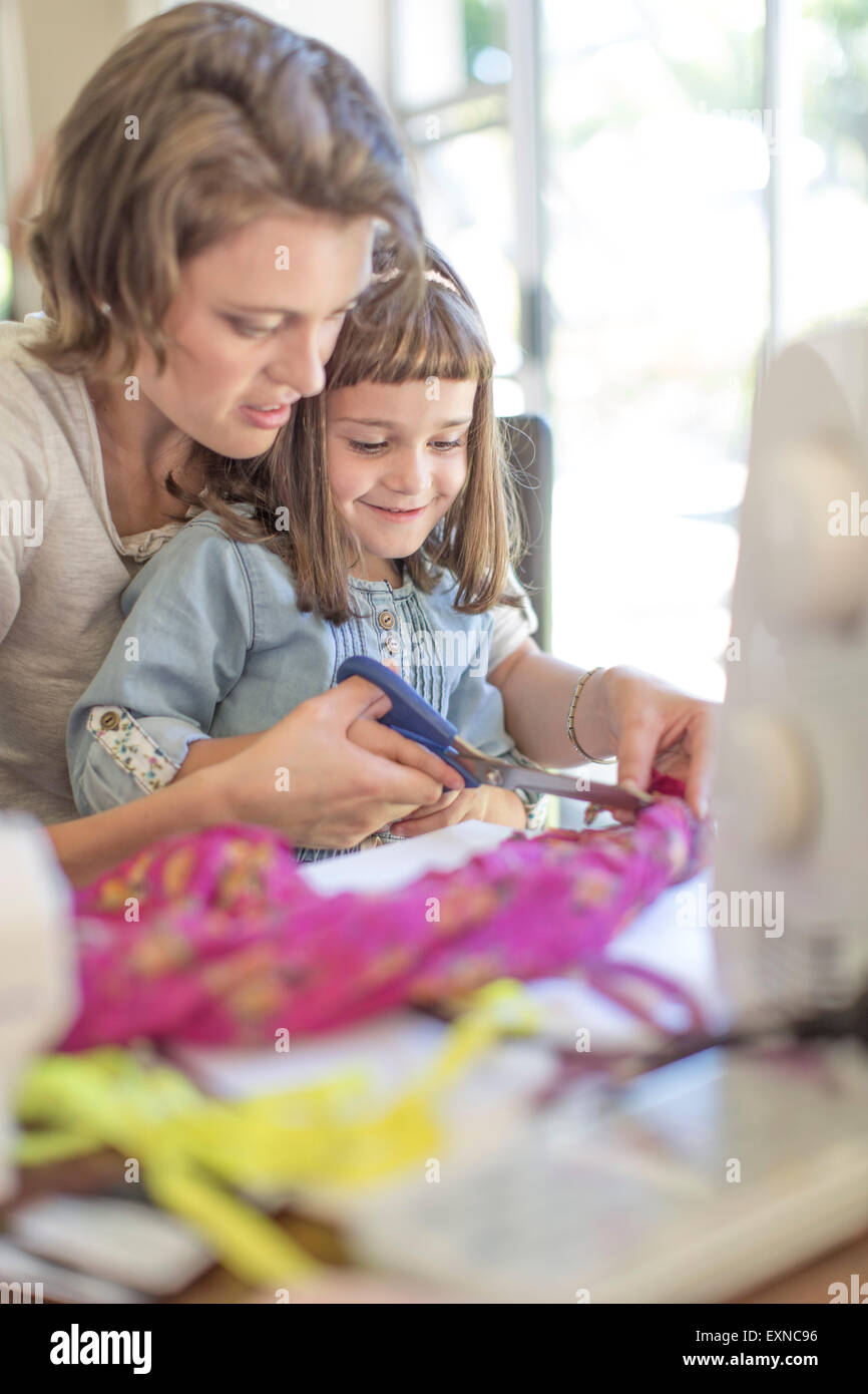 Mother and daughter making clothes at home Stock Photo - Alamy