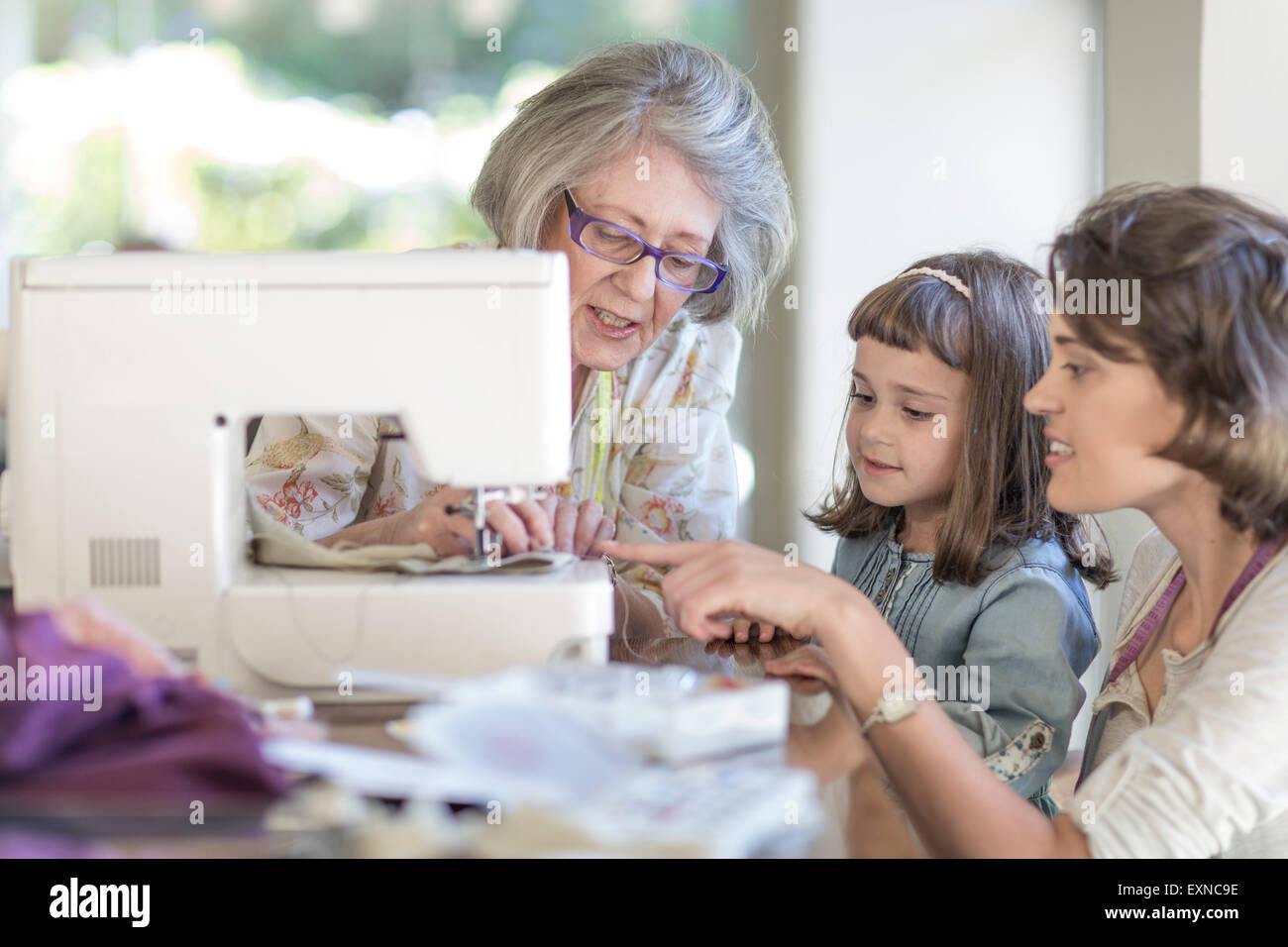 Grandmother mother sewing machine hi-res stock photography and images ...