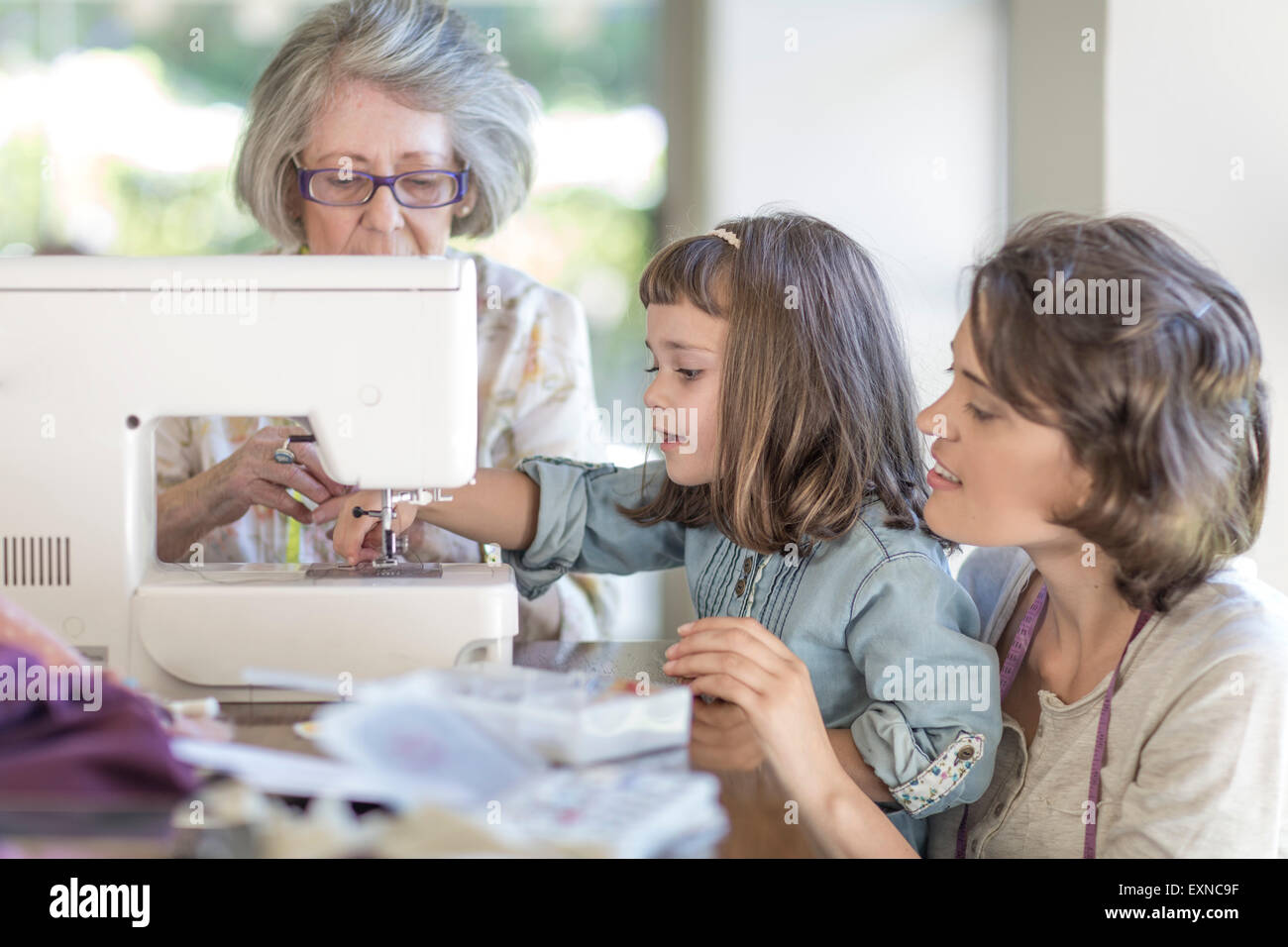 Grandmother mother sewing machine hi-res stock photography and images ...