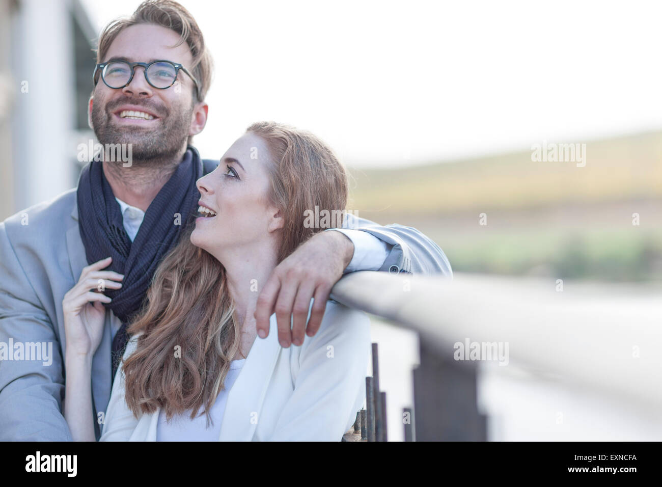 Happy couple relaxing on a terrace Stock Photo - Alamy