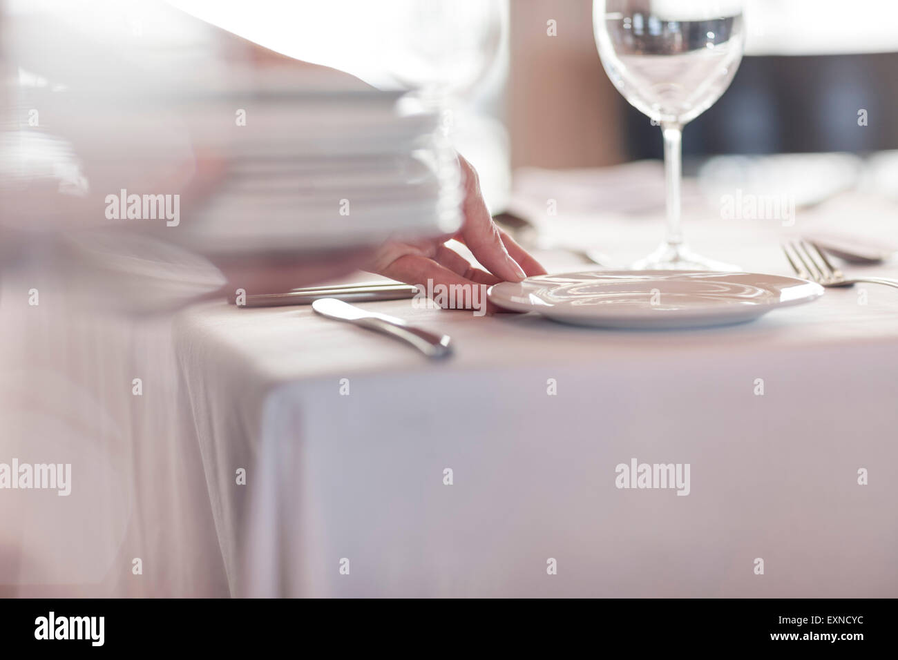 Restaurant staff setting tables Stock Photo - Alamy
