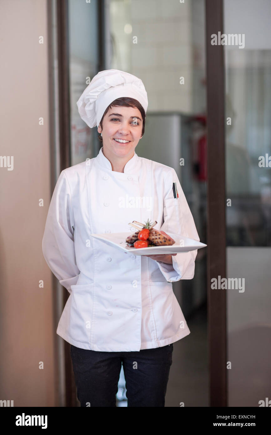 Chef serving main dish Stock Photo - Alamy