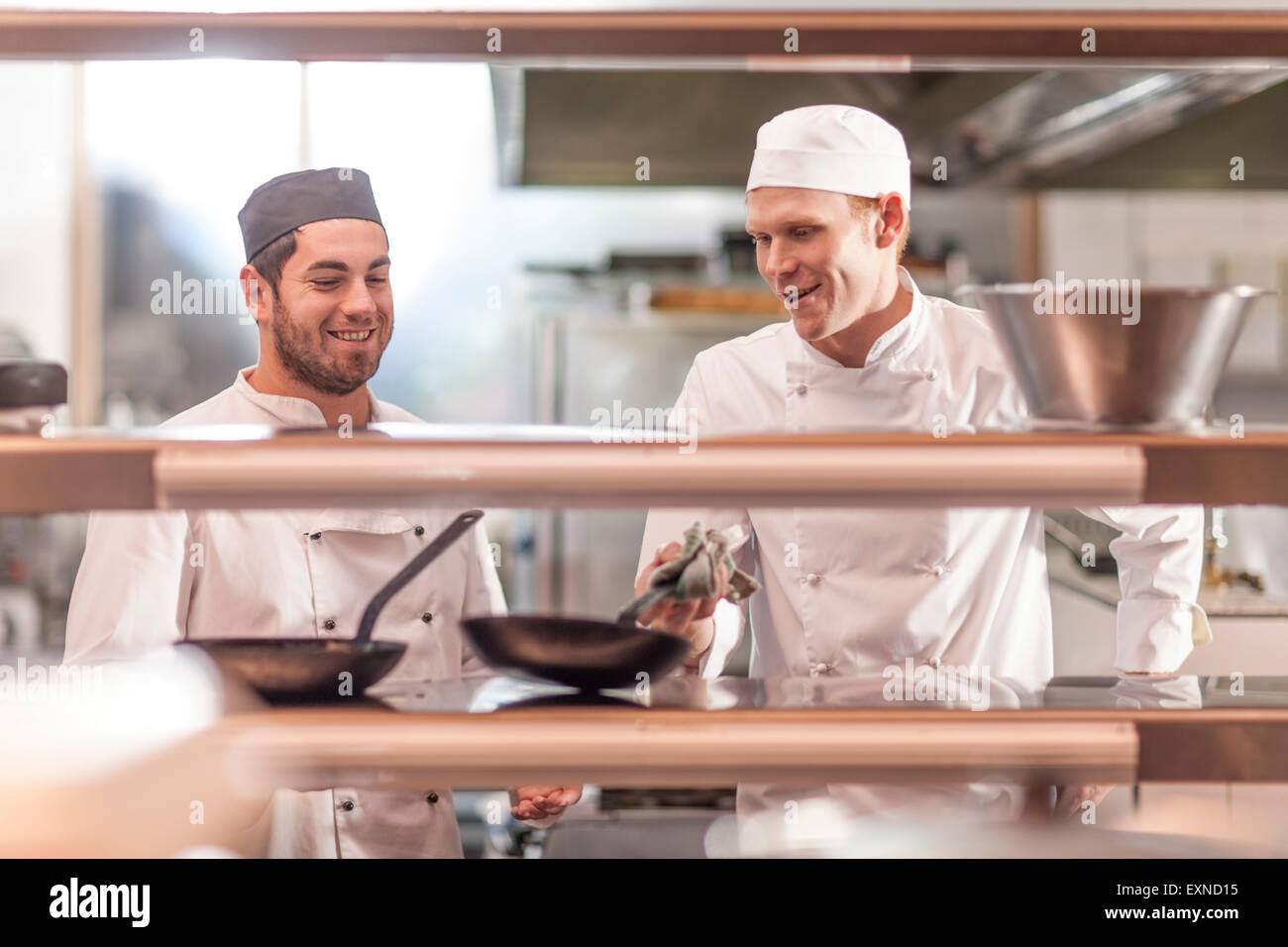 Chefs working in restaurant kitchen Stock Photo - Alamy