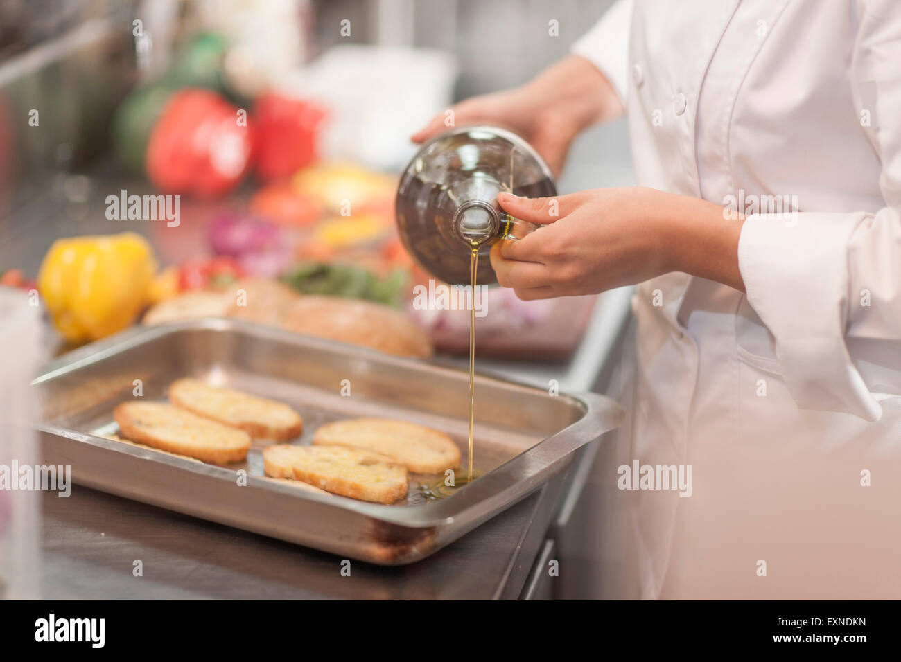 Chef preparing food in restaurant kitchen Stock Photo - Alamy